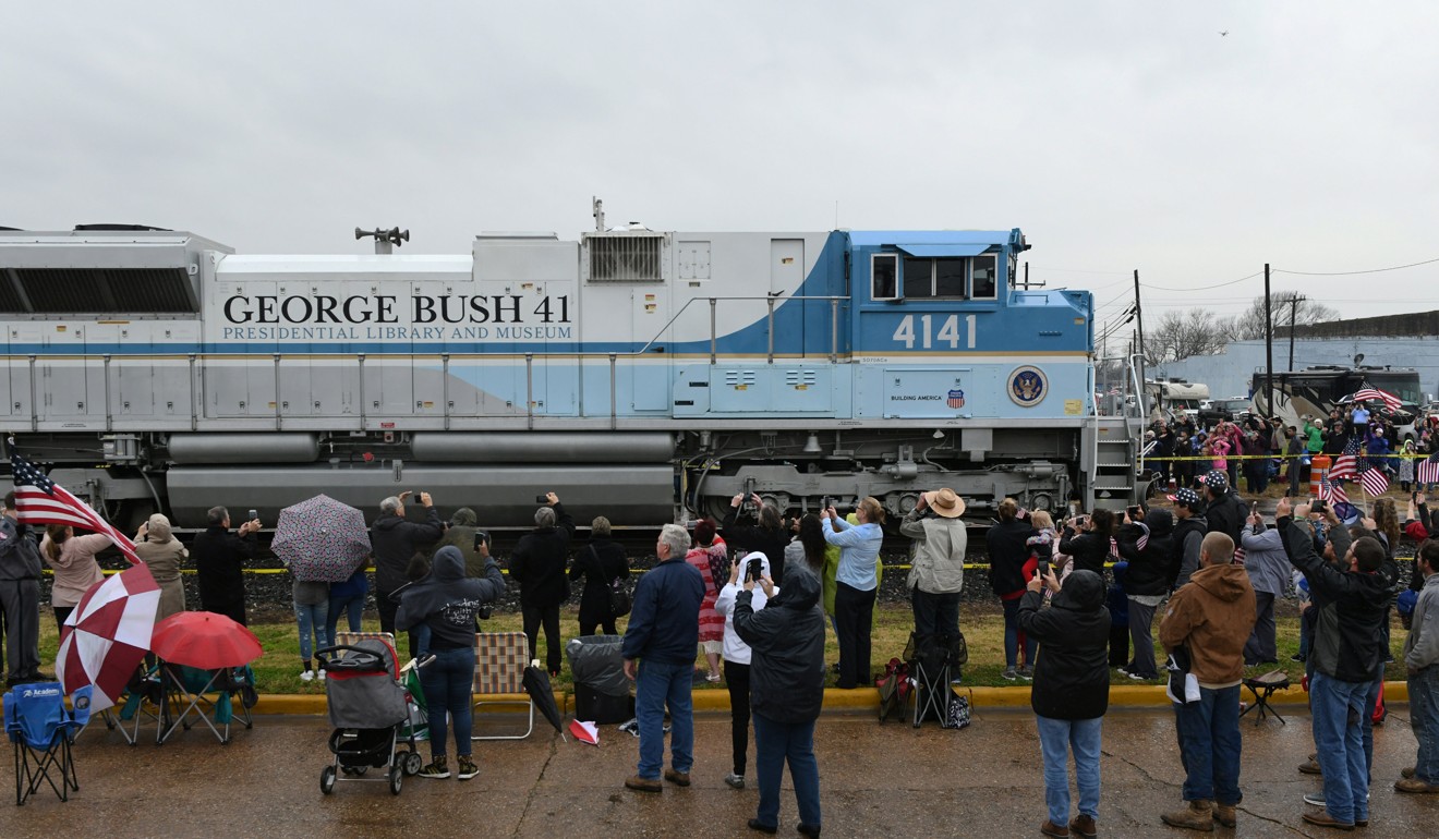 Thousands salute as funeral train 4141 carries George H.W. Bush on ...