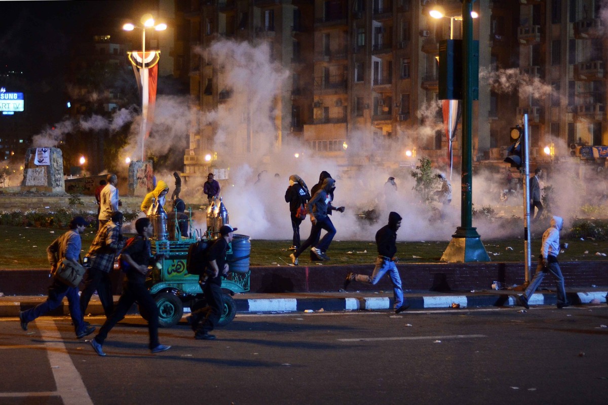 One killed as riot police storm Tahrir Square anniversary protest ...