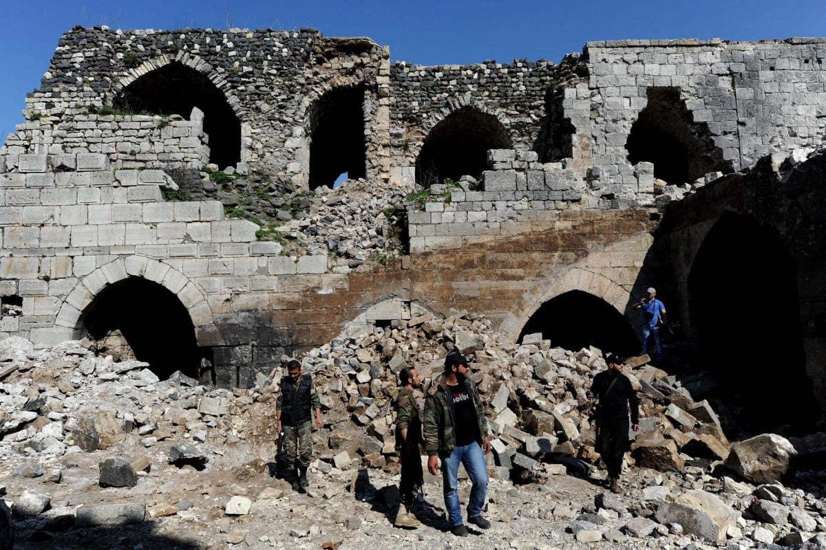 Syria's Krak des Chevaliers Crusader fortress charred and battered in ...