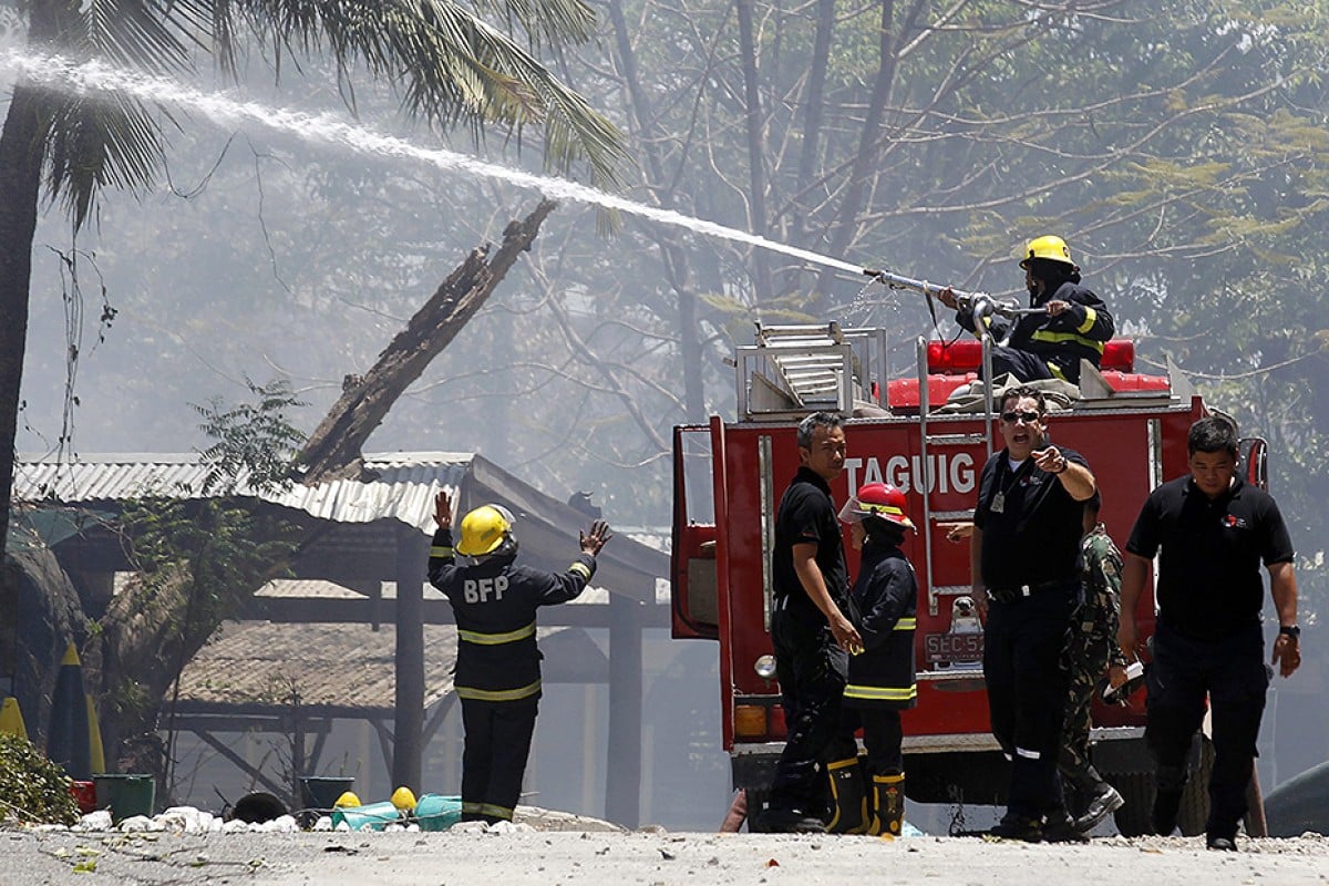 23 hurt as fire and blasts rock Philippines army munitions depot ...