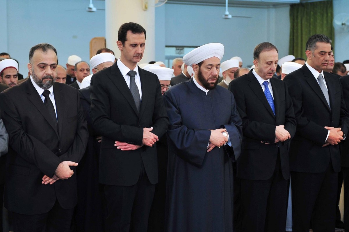 Syria's Bashar al-Assad makes rare public appearance for Eid prayers ...