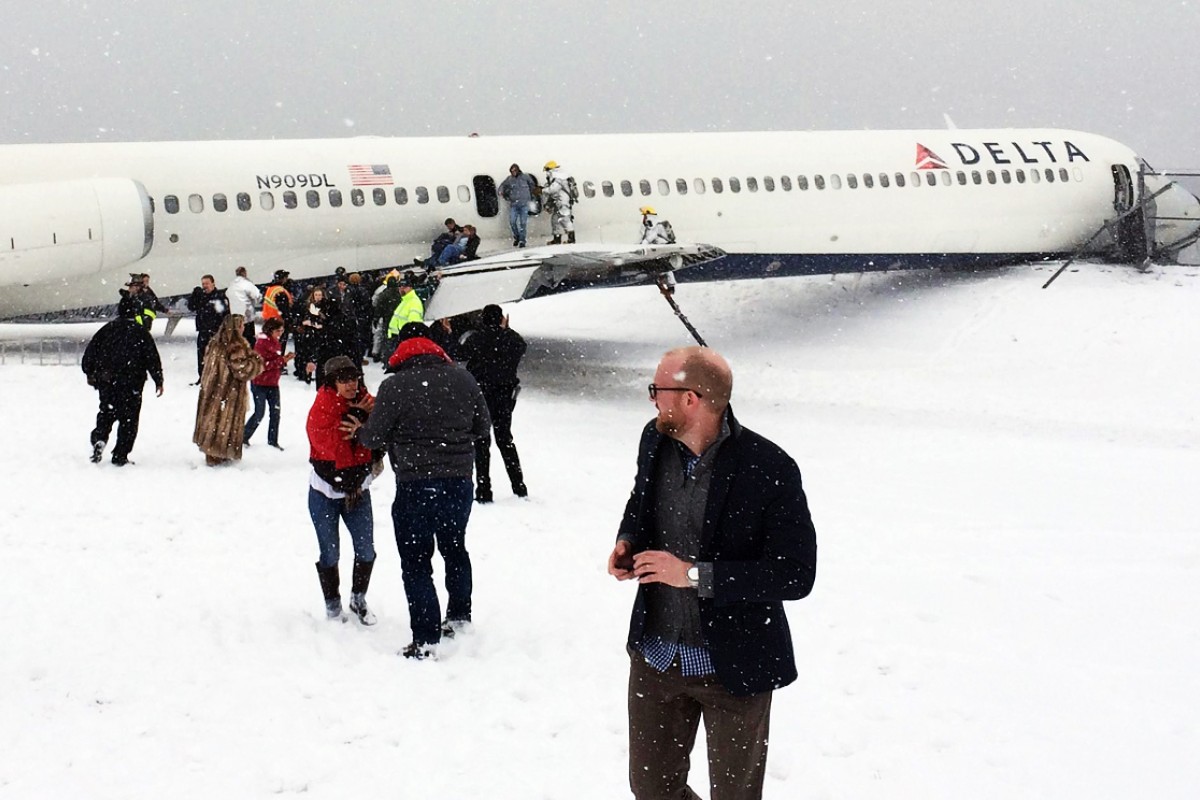 Airliner skids off tarmac in New York, as huge snowstorm causes travel ...