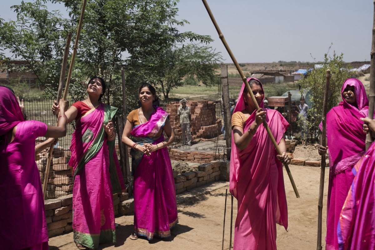 Meet the Gulabi Gang: stick-wielding women vigilantes standing up to ...