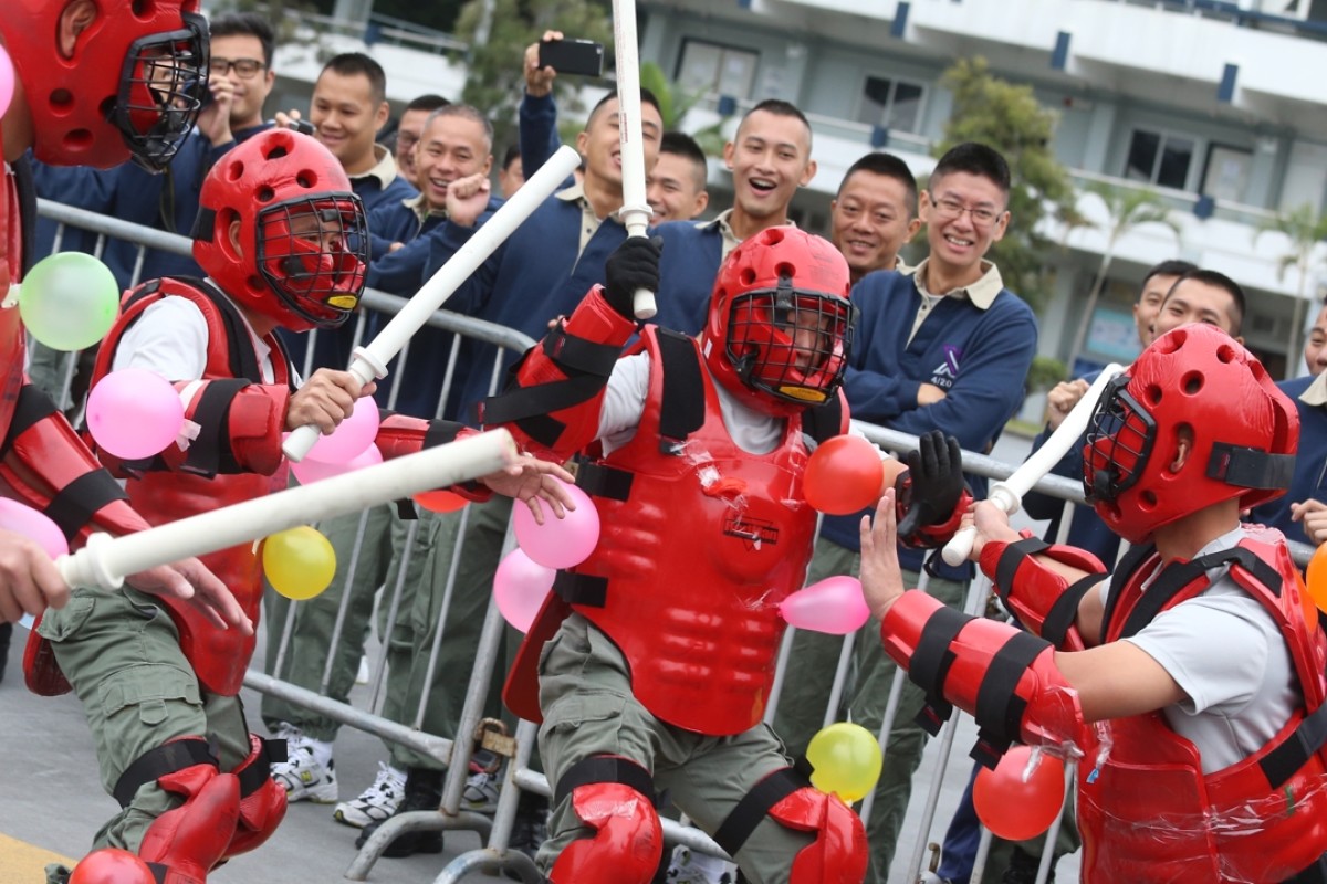 Hong Kong police fight balloon battle for charity | South China Morning ...