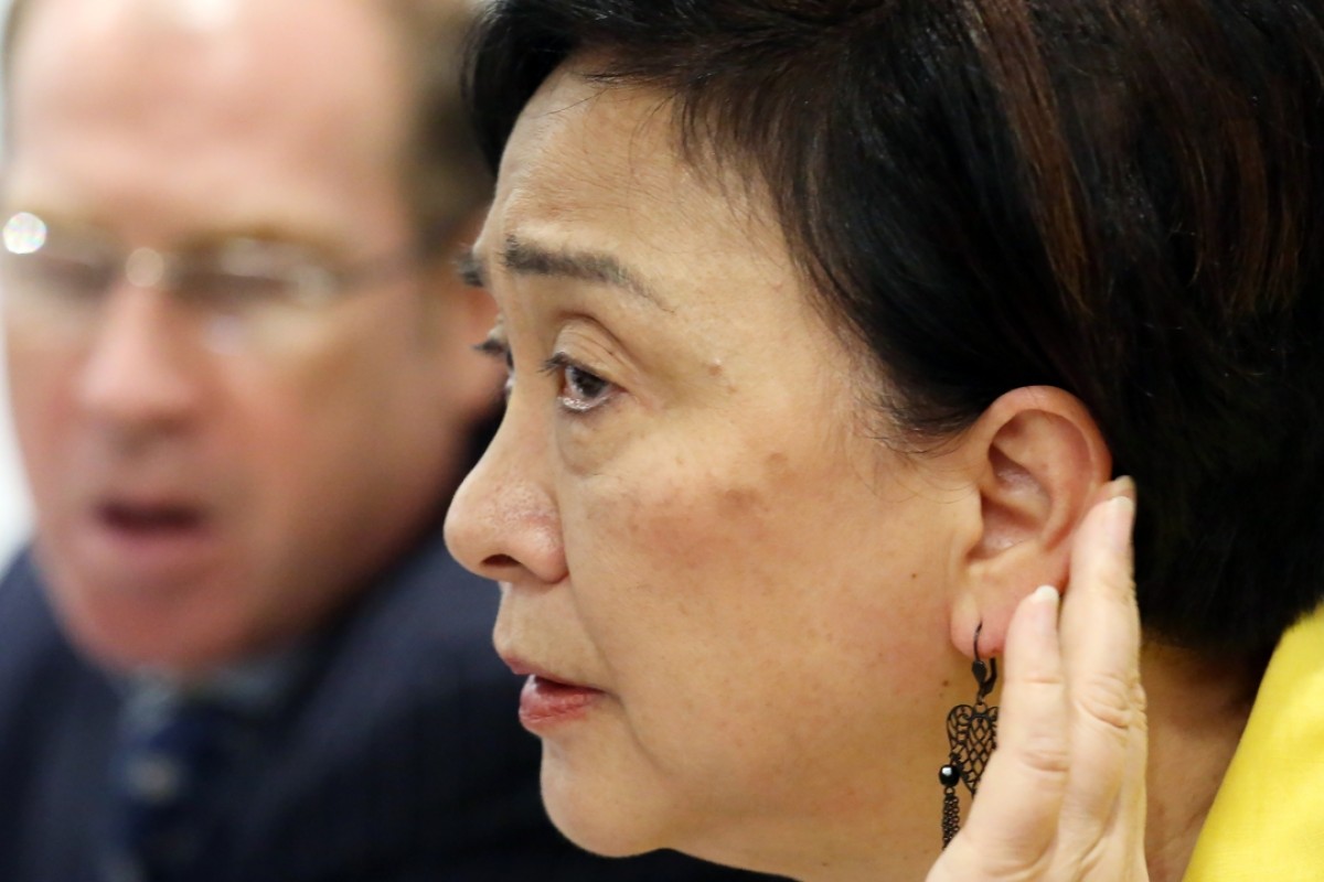 A lifeline: Hong Kong lawmaker Emily Lau helps out on domestic helper ...