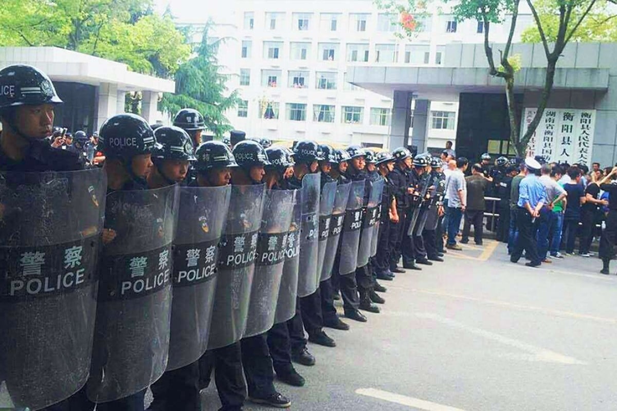 Riot police deployed as teachers in central China stage protest over ...
