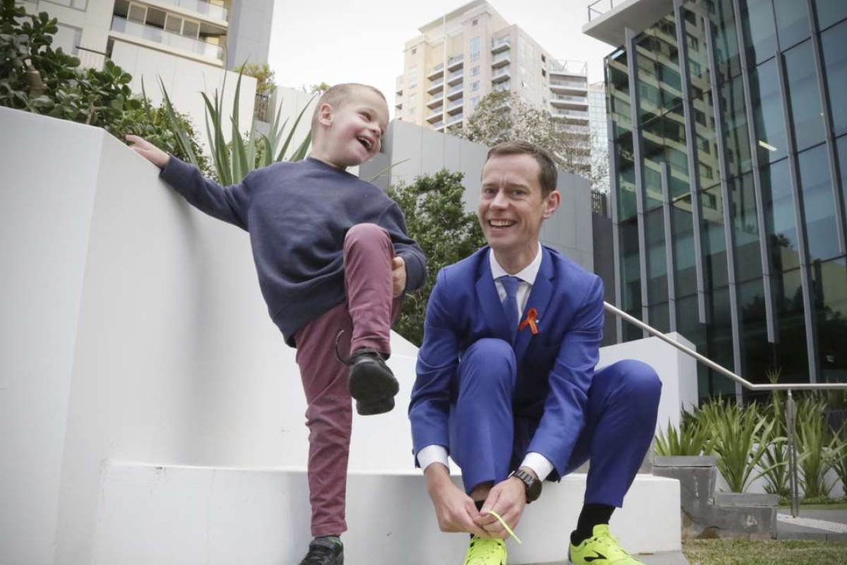 Hongkonger runs race in suit and tie to raise awareness of genetic ...