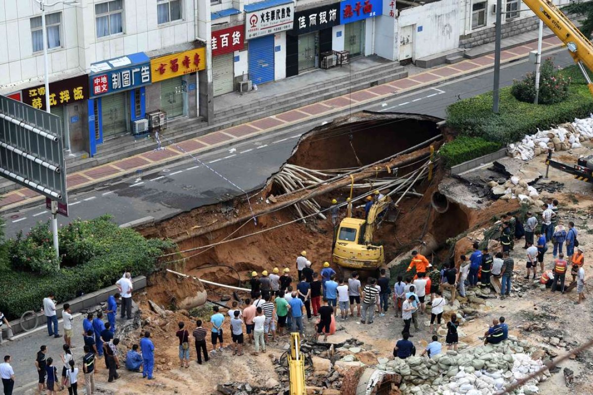 Two people missing in central China after being swallowed by huge city ...