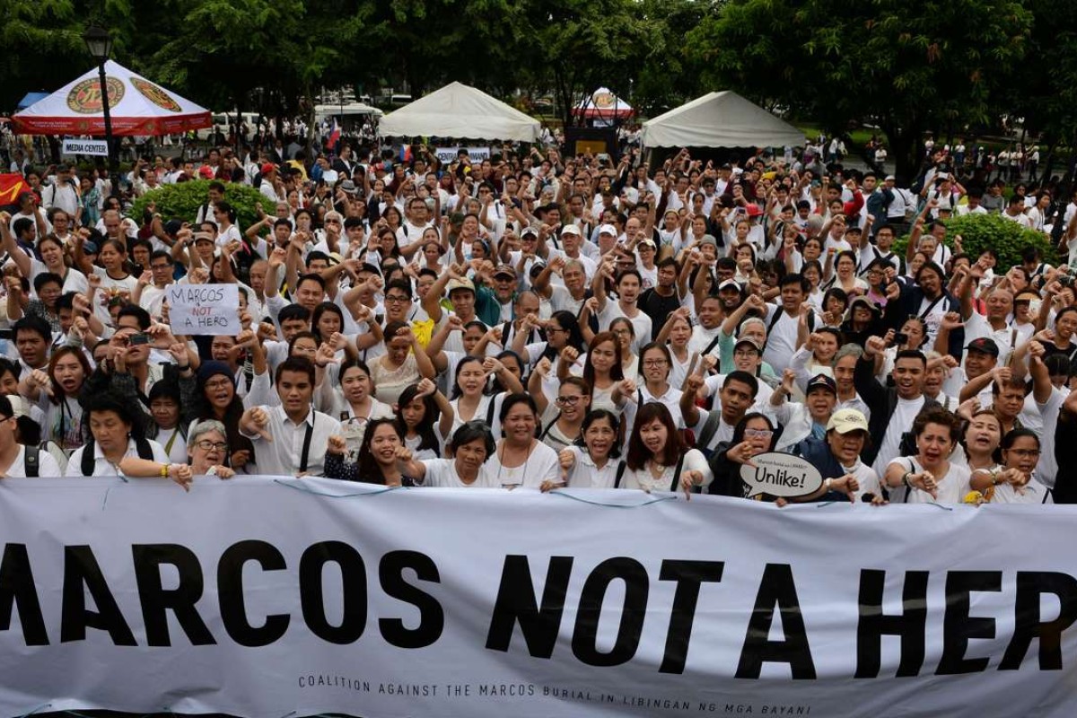 Hundreds protest ‘hero’s burial’ for Philippine dictator Marcos | South ...