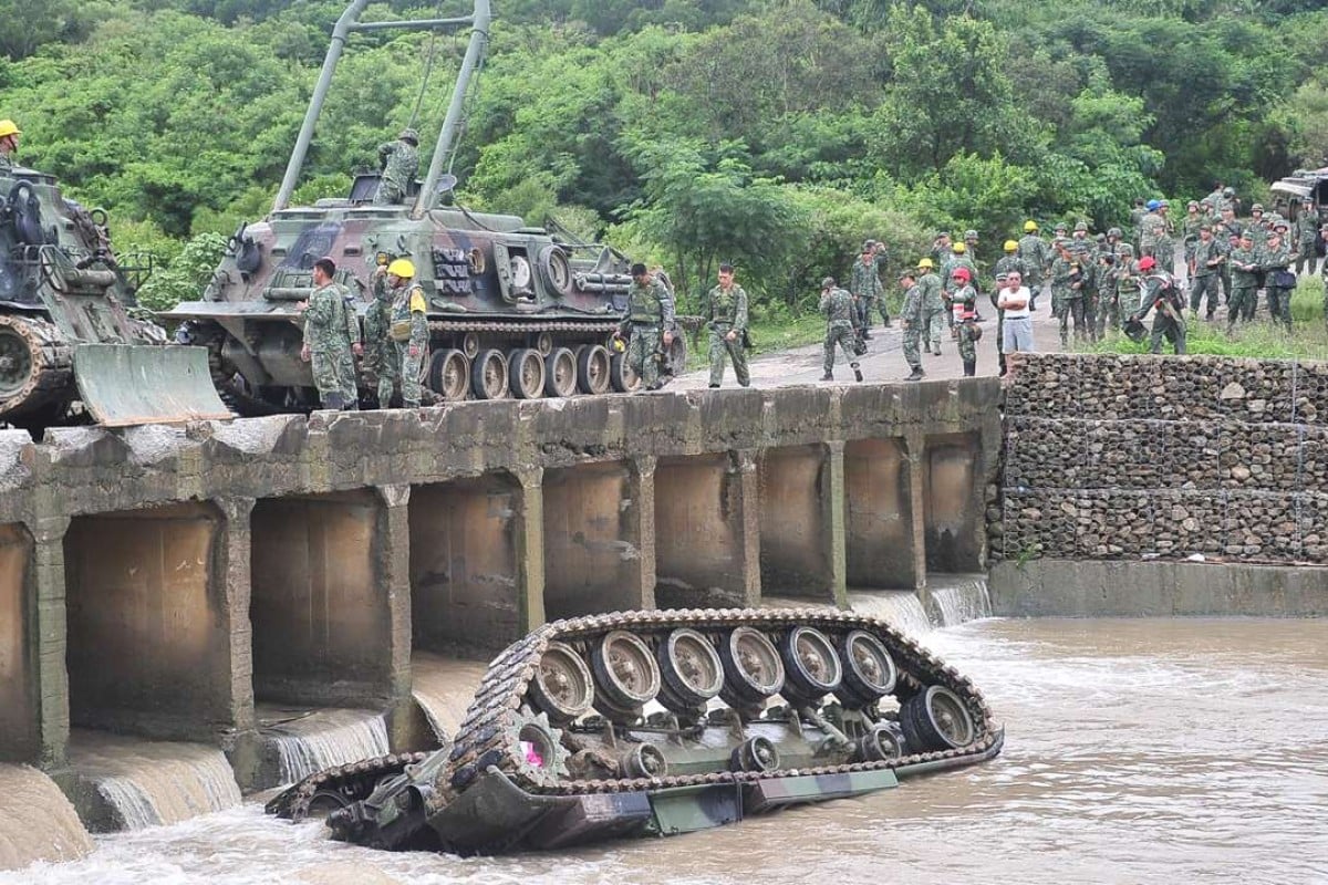 Three Taiwanese soldiers killed after tank falls off bridge in heavy ...