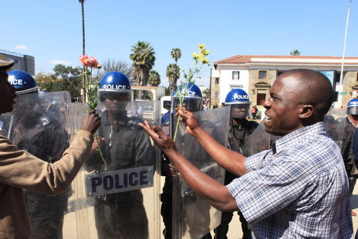 Zimbabwe riot police use teargas, water cannon to break up anti ...