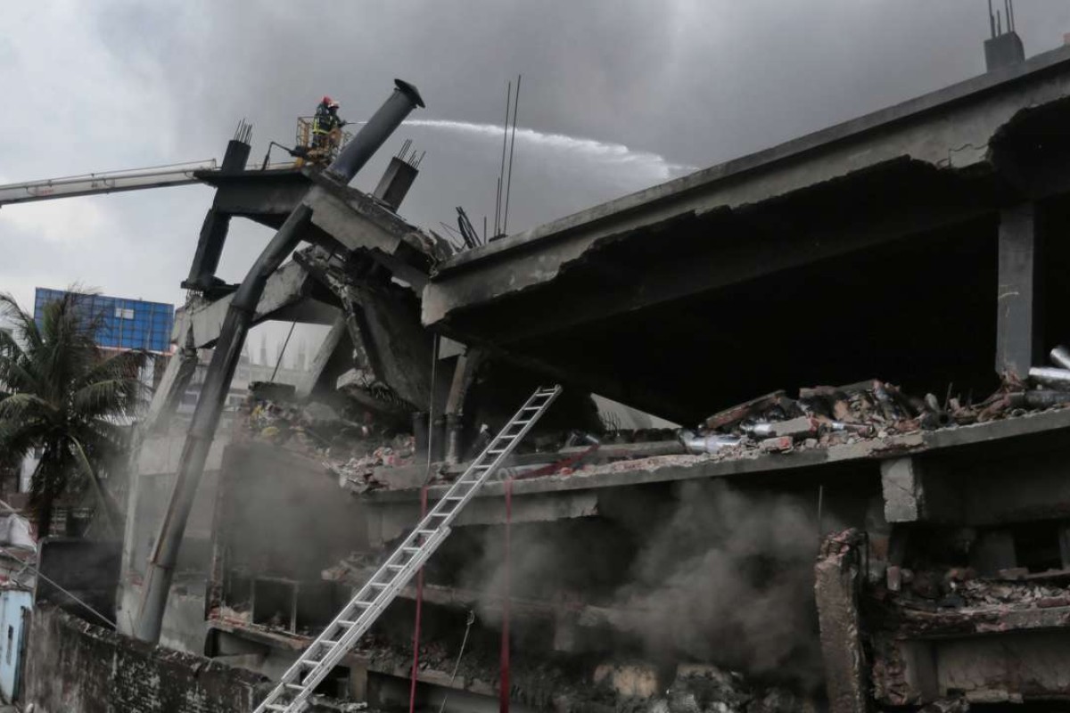 ‘There are small pits of fire inside’: Bangladeshi officials struggle to search factory ...