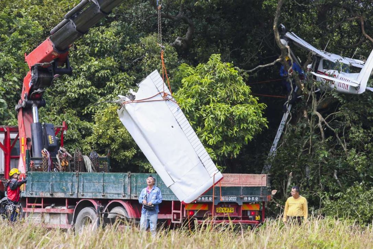 Plane that crashed into trees at Hong Kong golf course is cut free ...