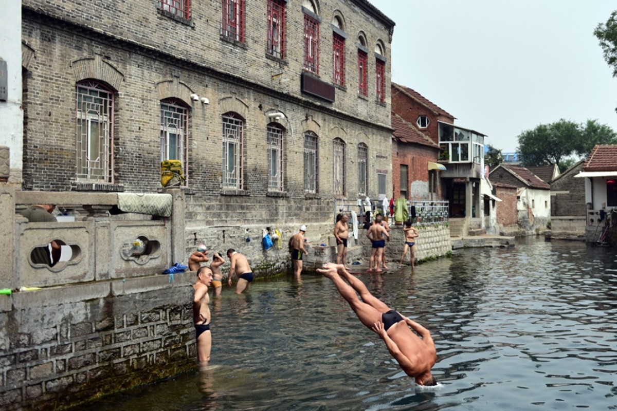 Bathers swim, do laundry in Chinese protected spring | South China ...