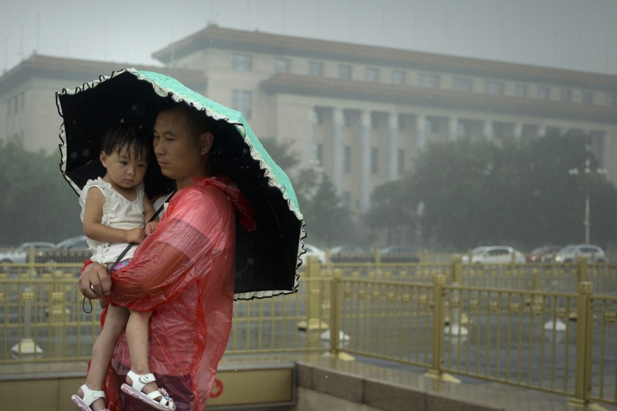 Travellers stuck as rain continues to batter China | South China ...