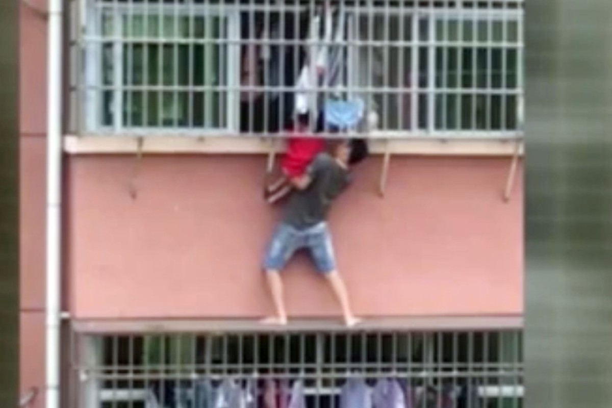 Chinese man risks life to save boy, 4, dangling by his neck from window ...