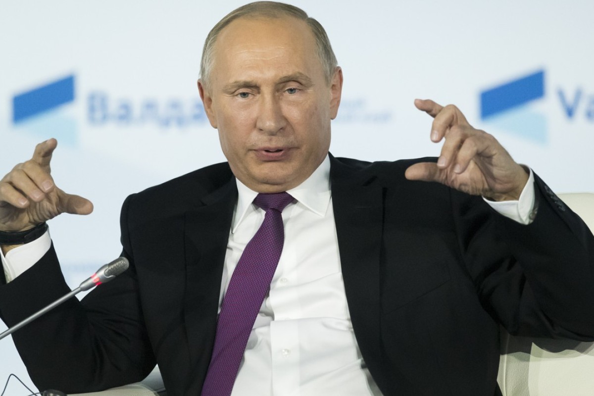 Putin lashes US foreign policy but keeps quiet on running again for ...