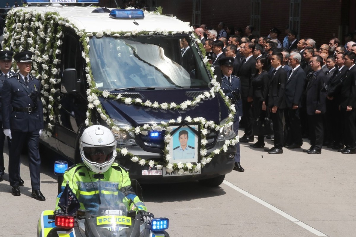 Top Hong Kong officials pay respects at funeral of police officer ...