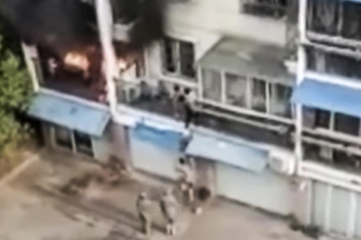 Neighbours team up to rescue two young girls from burning building in ...