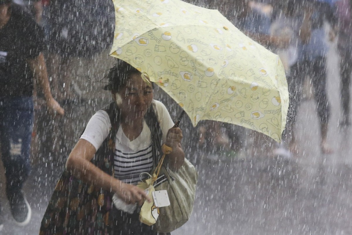 Hong Kong Observatory cancels amber rainstorm warning but wet weather ...