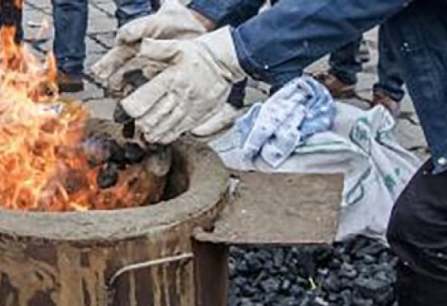 Chinese construction worker locked up for burning old tyres to keep ...