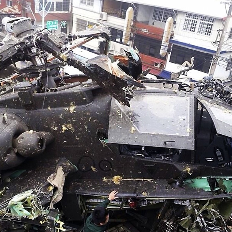 Two Taiwan pilots injured as Apache chopper crashes into building ...