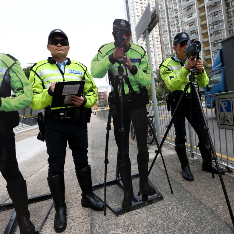 Cardboard cops retired from Hong Kong's roads (they just weren't cut ...