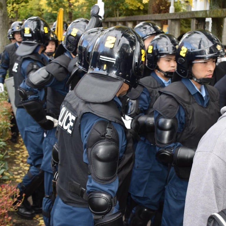 Fully-clad riot police raid dormitory at Kyoto University in Japan ...
