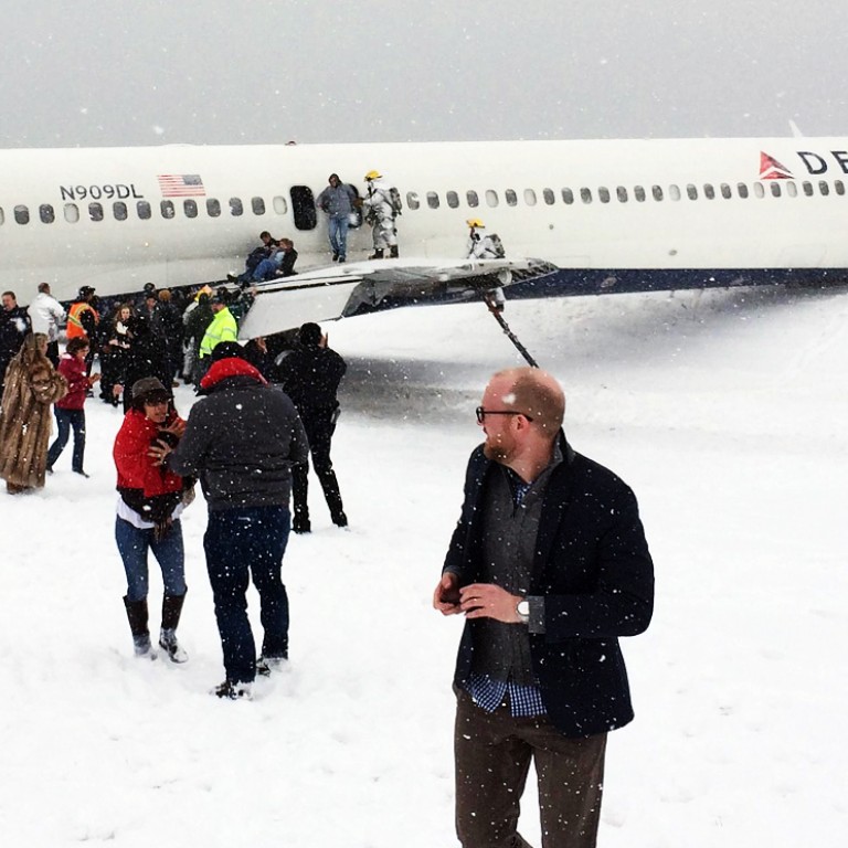 Airliner skids off tarmac in New York, as huge snowstorm causes travel ...