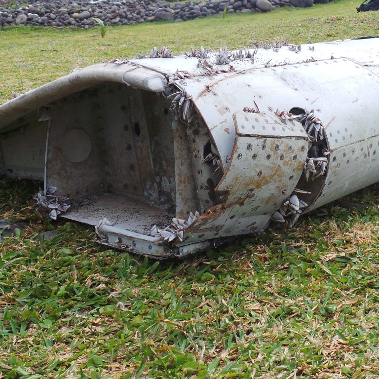 World waits for first clues about MH370 mystery as technical experts in ...