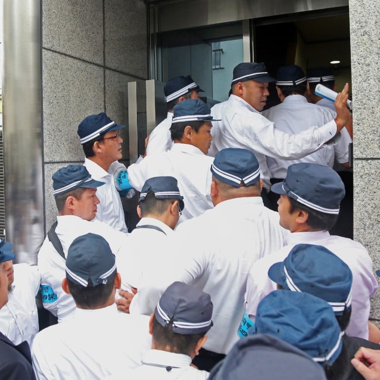Japanese police raid yakuza offices as split raises fears of gang ...