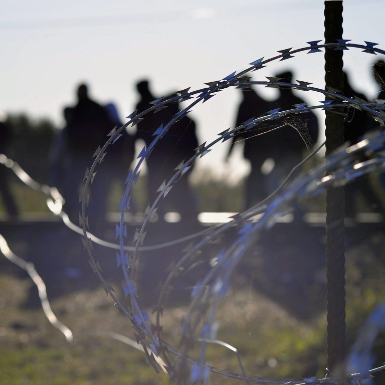 Hungary speeds up work on anti-refugee barrier as Austria compares ...