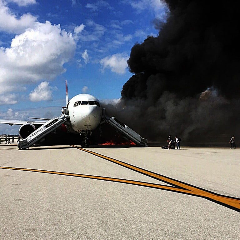 ‘Engine’s on fire!’: 15 passengers hurt as jet erupts in flames at ...