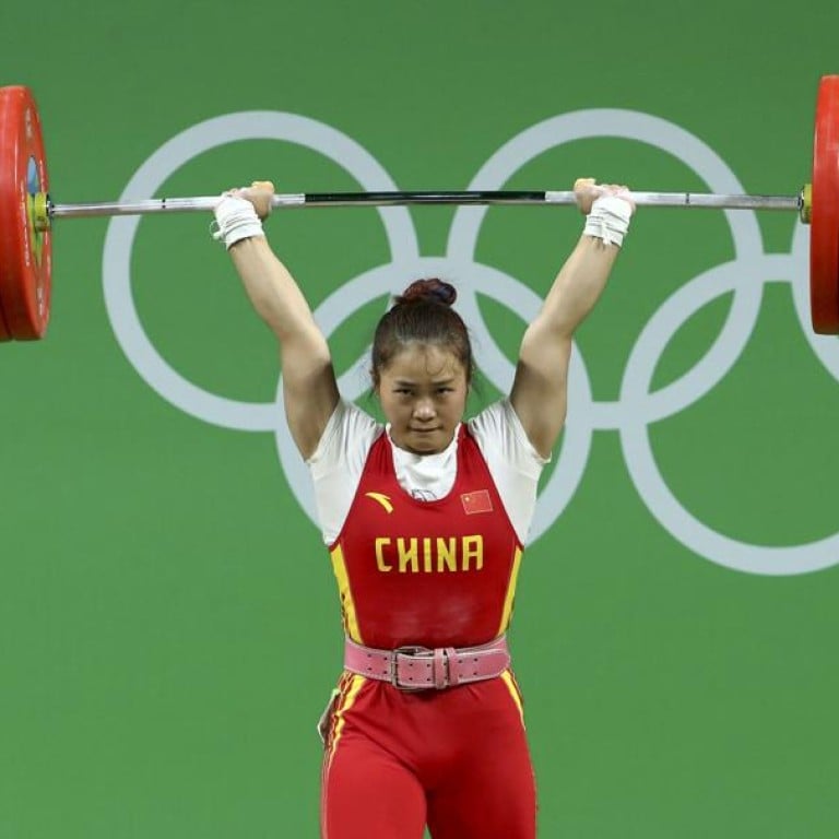 China’s Deng Wei lifts gold with a world record as main rival is ...