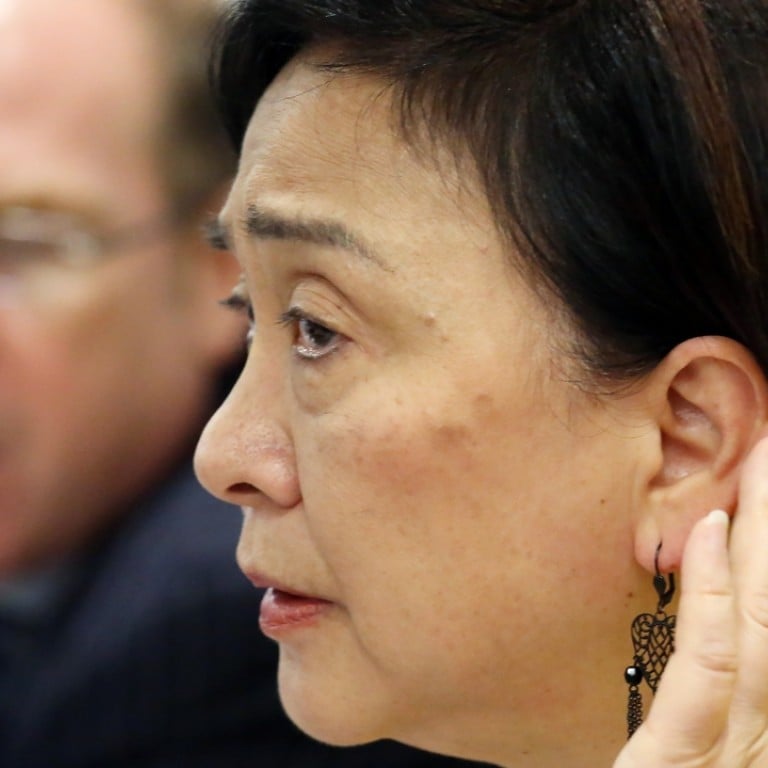 A lifeline: Hong Kong lawmaker Emily Lau helps out on domestic helper ...