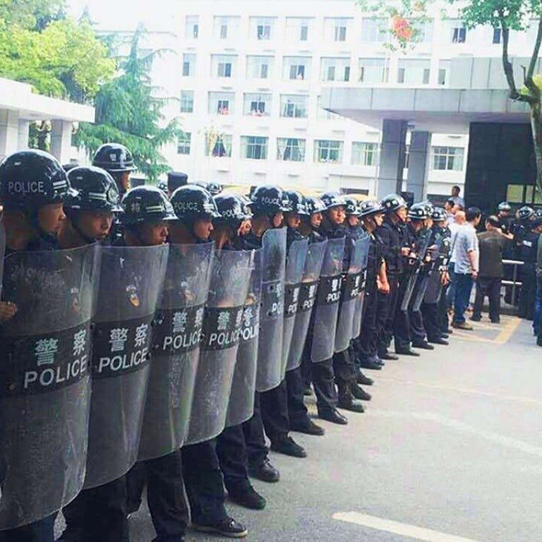 Riot police deployed as teachers in central China stage protest over ...