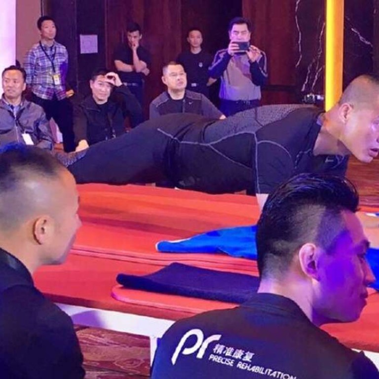Man of steel: Chinese SWAT team member beats world record for holding ...