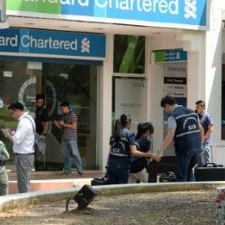 Mystery heist: how did robber steal US$22,000 from Singapore bank armed ...