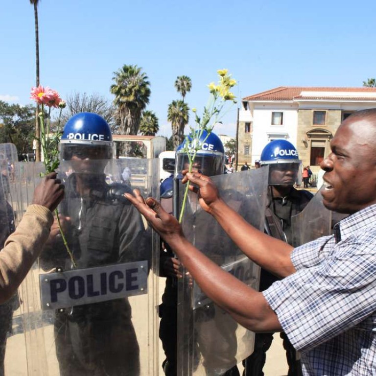 Zimbabwe riot police use teargas, water cannon to break up anti ...