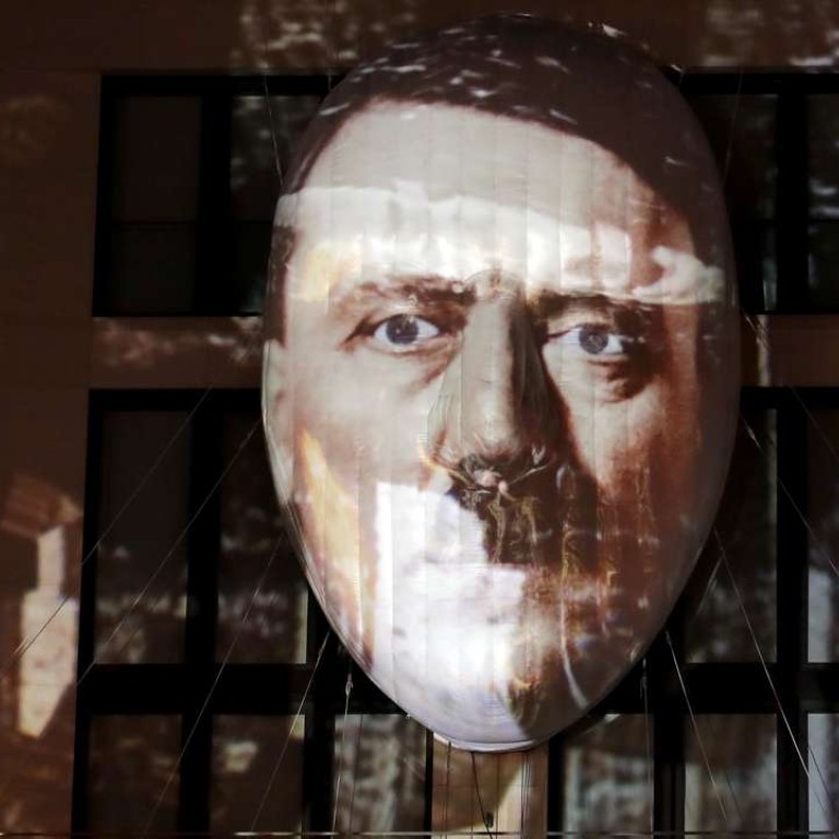 Larger-than-life laughing Hitler appears in Berlin; police called in ...