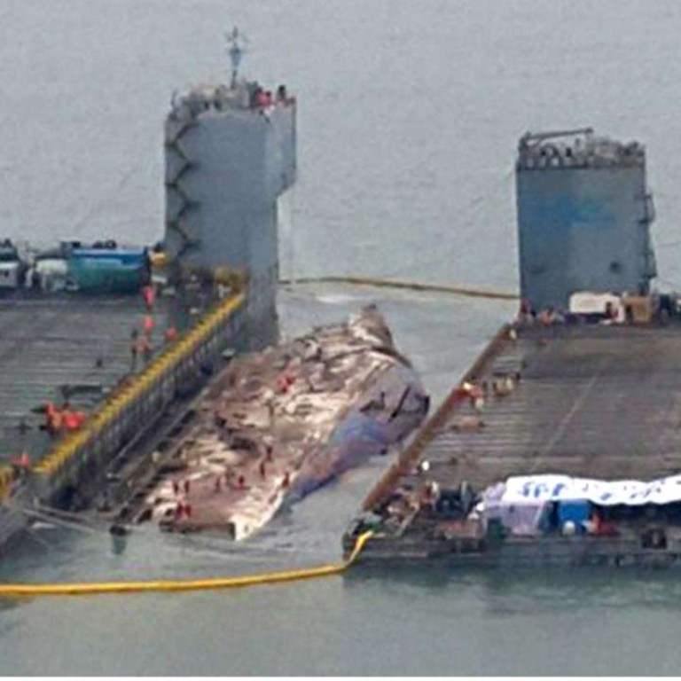 Sewol rises: South Korean ferry that sank three years ago lifted from ...