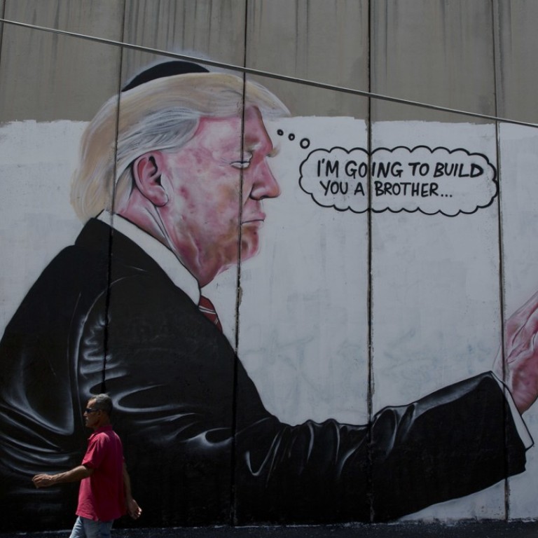 Banksy strikes again? Two giant murals taking aim at Donald Trump ...