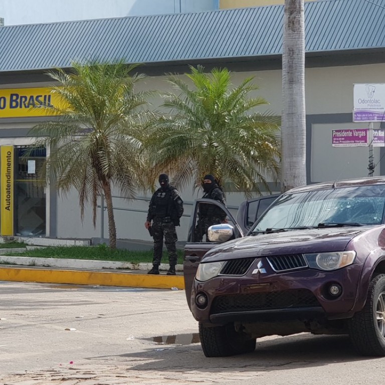 14 killed in shoot-out with police during double bank robbery in small ...
