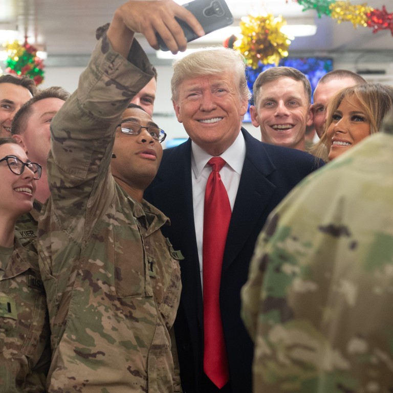 Donald Trump surprises troops with secret trip to Iraq, his first ...