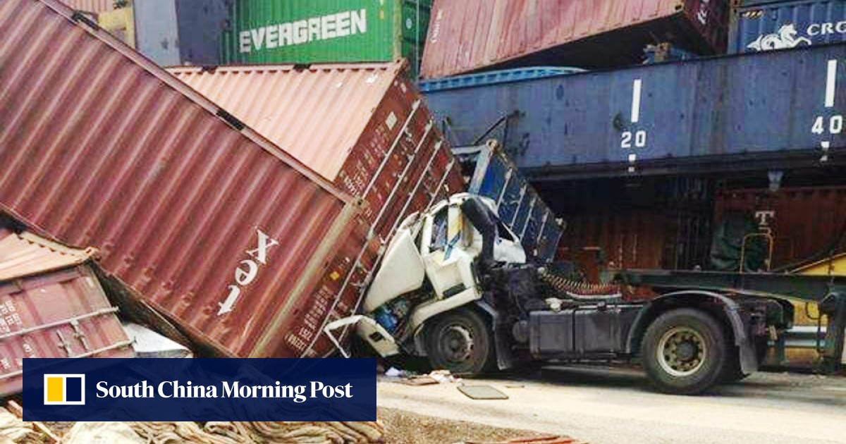 Unconscious driver pulled from truck crushed by tumbling shipping ...