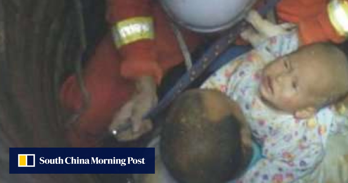 Chinese toddler rescued by firefighters after falling 6 metres into ...