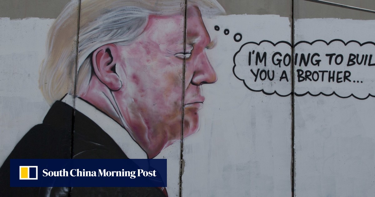 Banksy strikes again? Two giant murals taking aim at Donald Trump ...