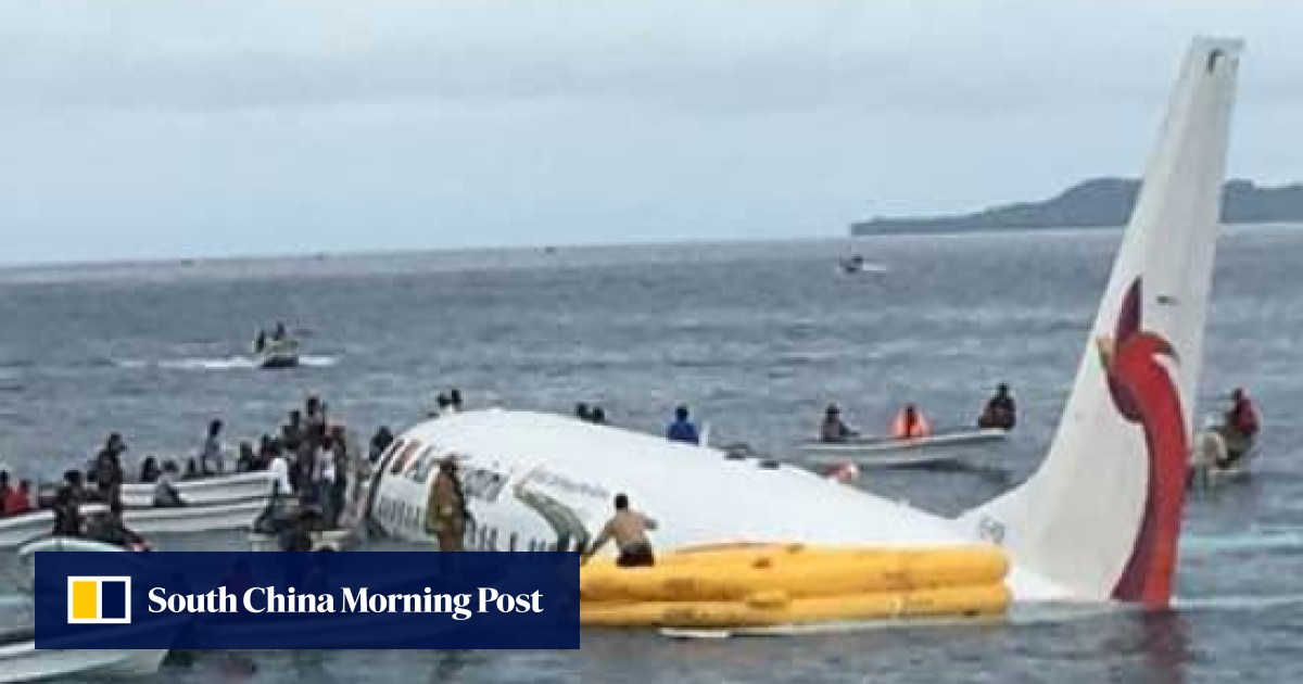Papua New Guinea plane overshoots Micronesia runway and sinks in lagoon ...